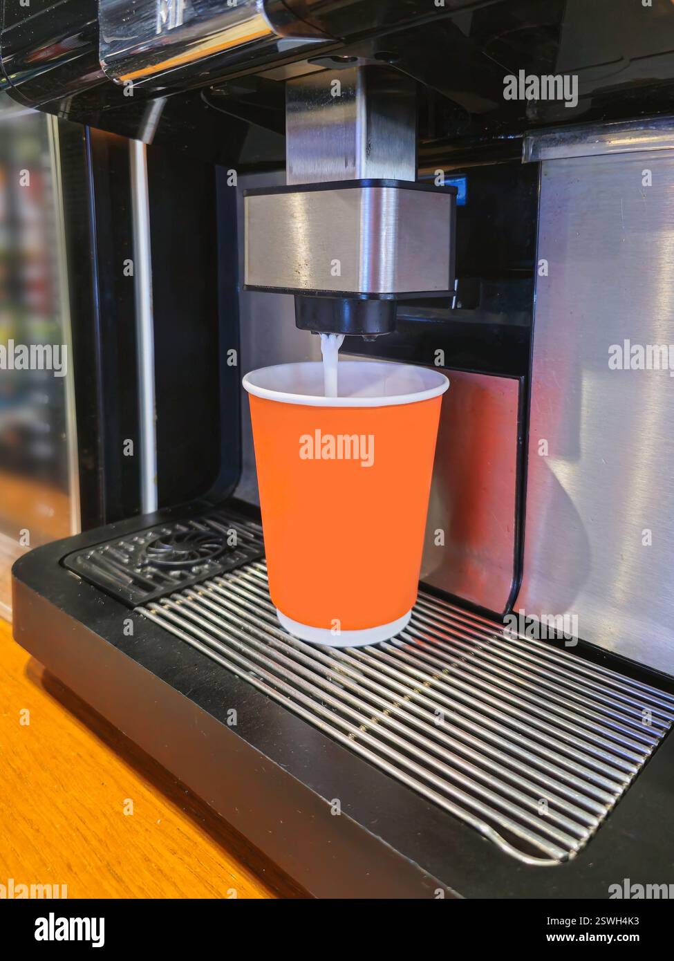 Process of making latte coffee in a coffee machine Stock Photo - Alamy