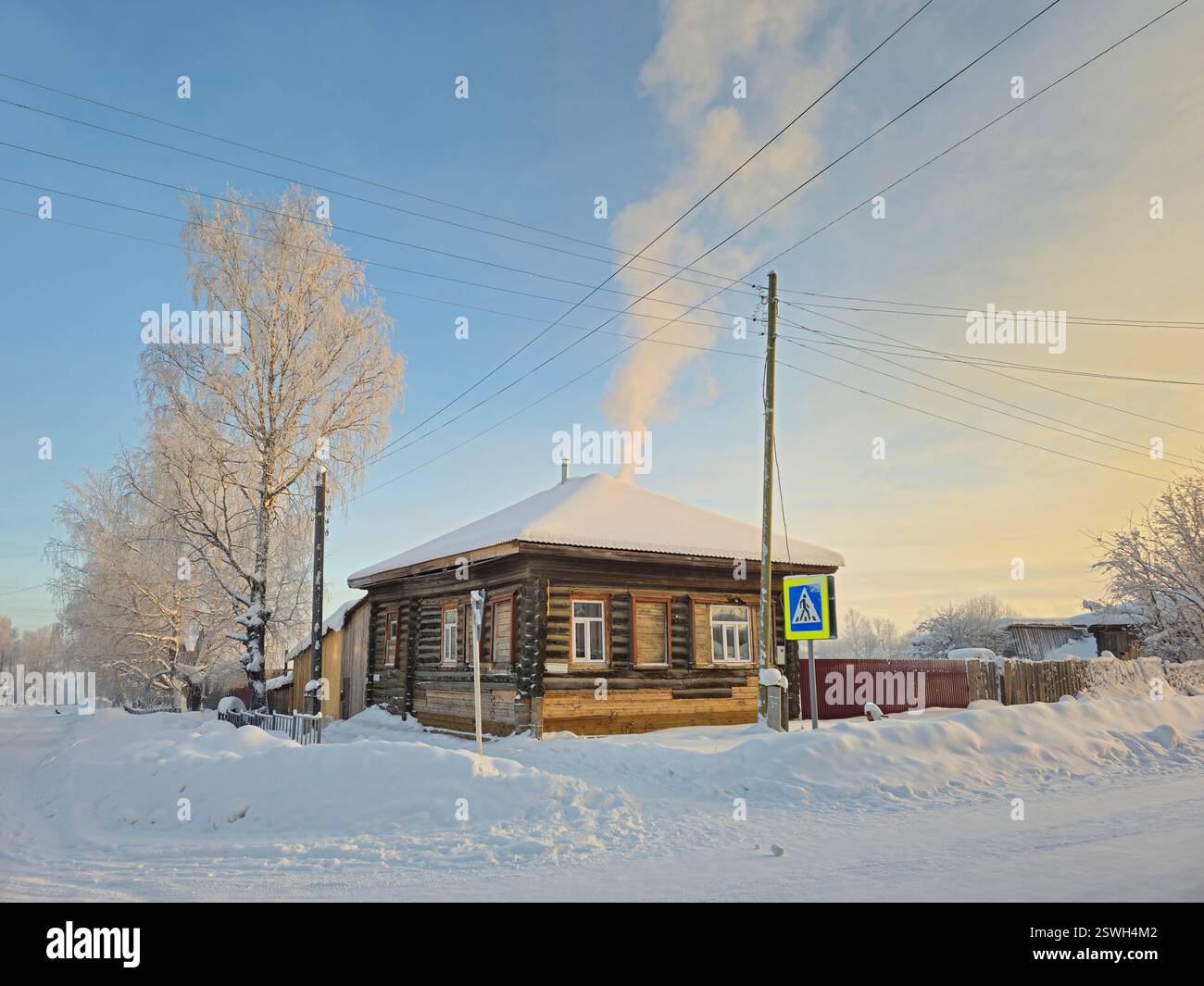 Rustic wooden house under the snow. Rural street Stock Photo - Alamy