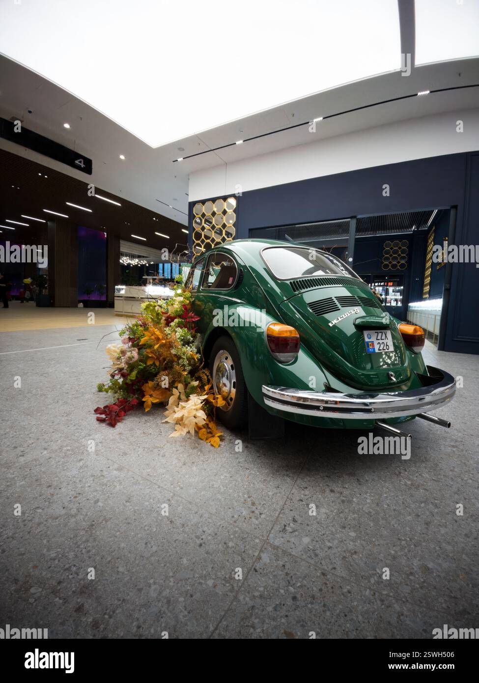 Vintage car, floral installation in a shopping mall Stock Photo - Alamy