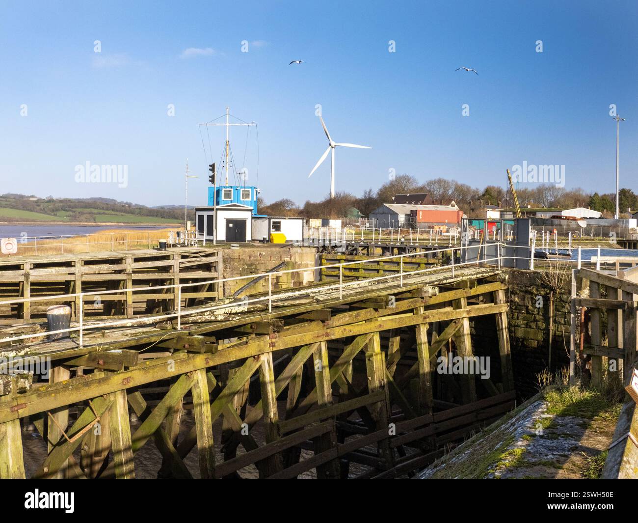 Old wooden jetties at Sharpness docks on the River Severn ...