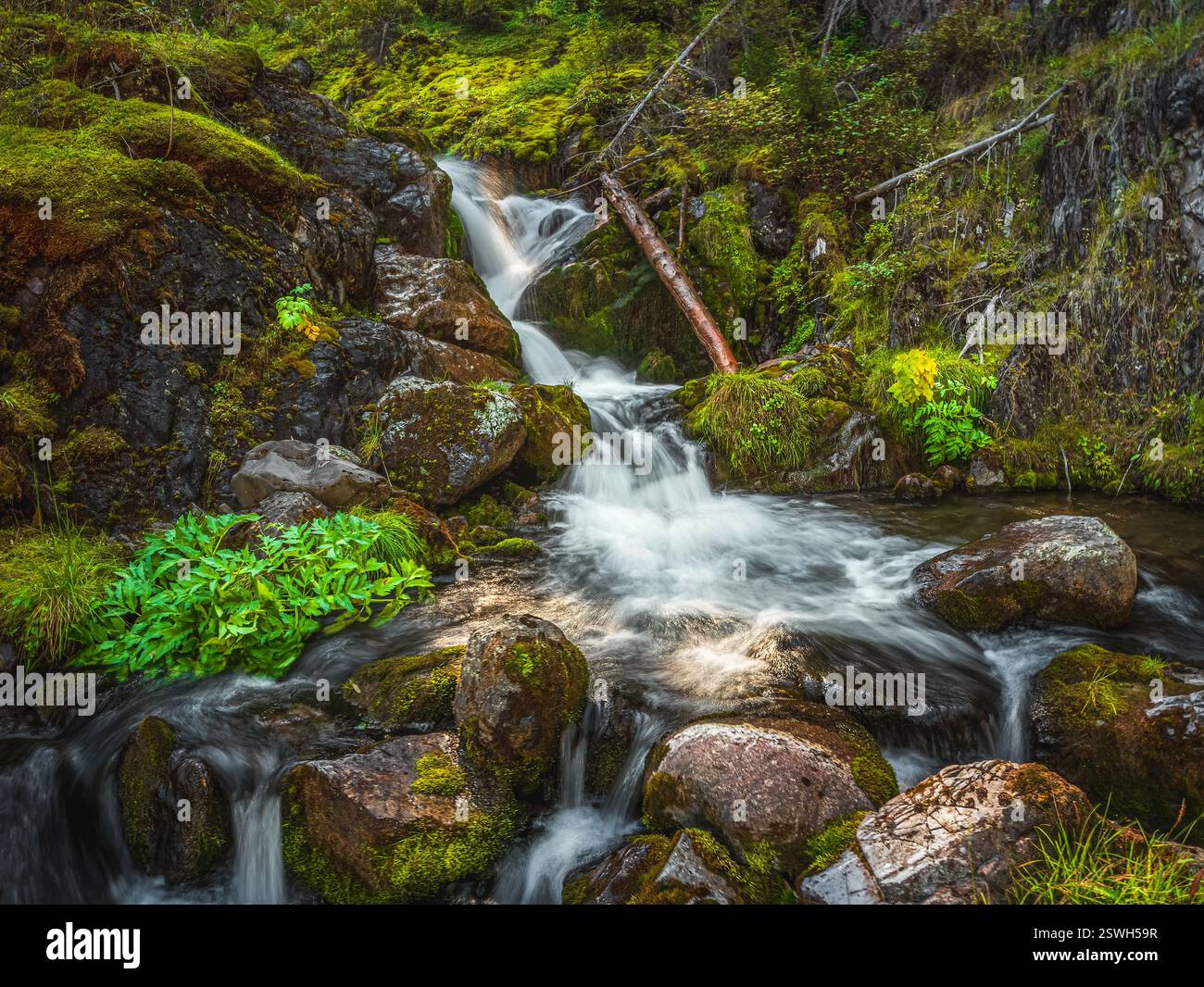 Atmospheric minimal landscape with a long exposure of a large waterfall ...