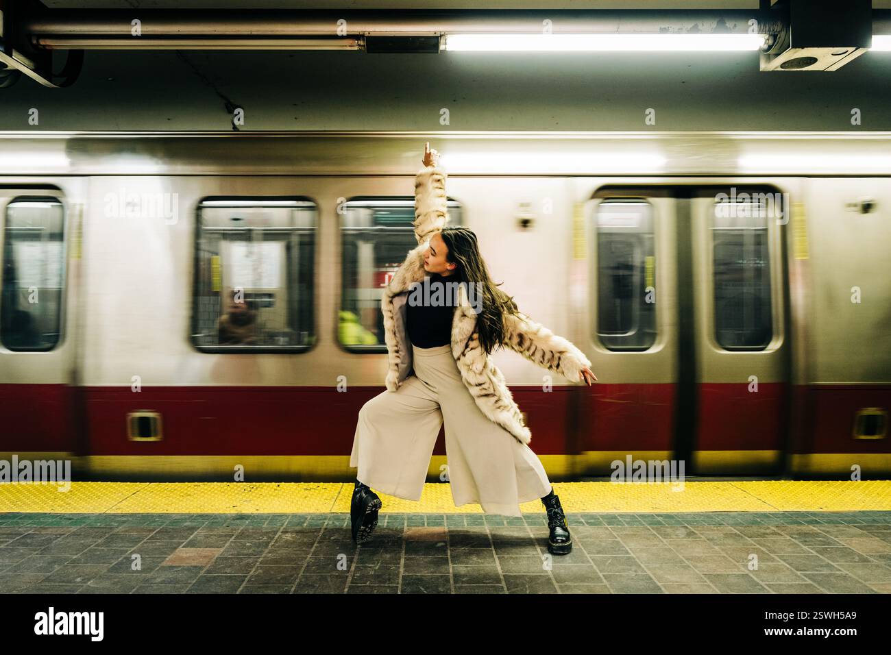 Woman strikes dynamic pose hi-res stock photography and images - Alamy