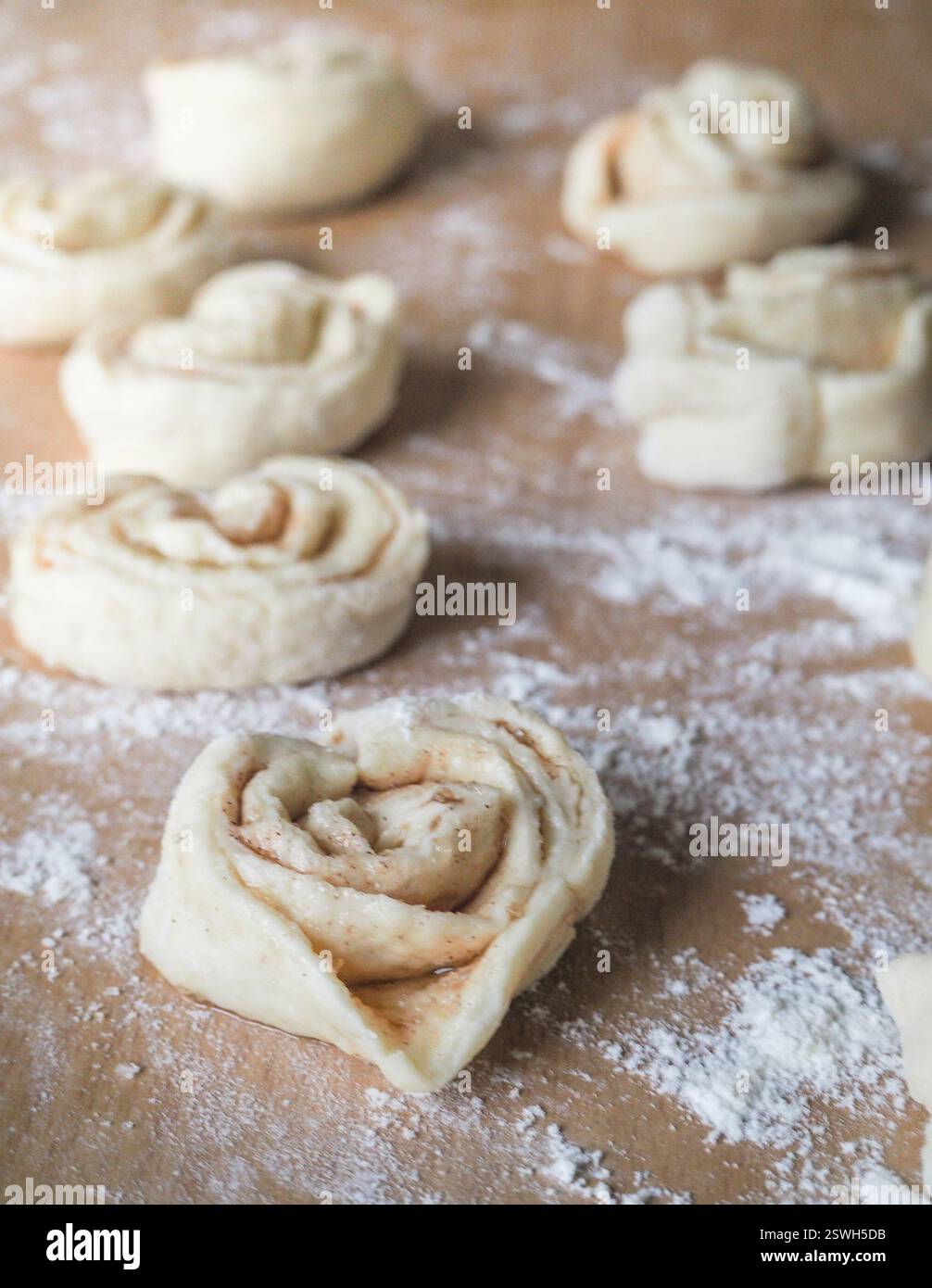 Making sweet rolls dough. Puff pastry pies Stock Photo - Alamy
