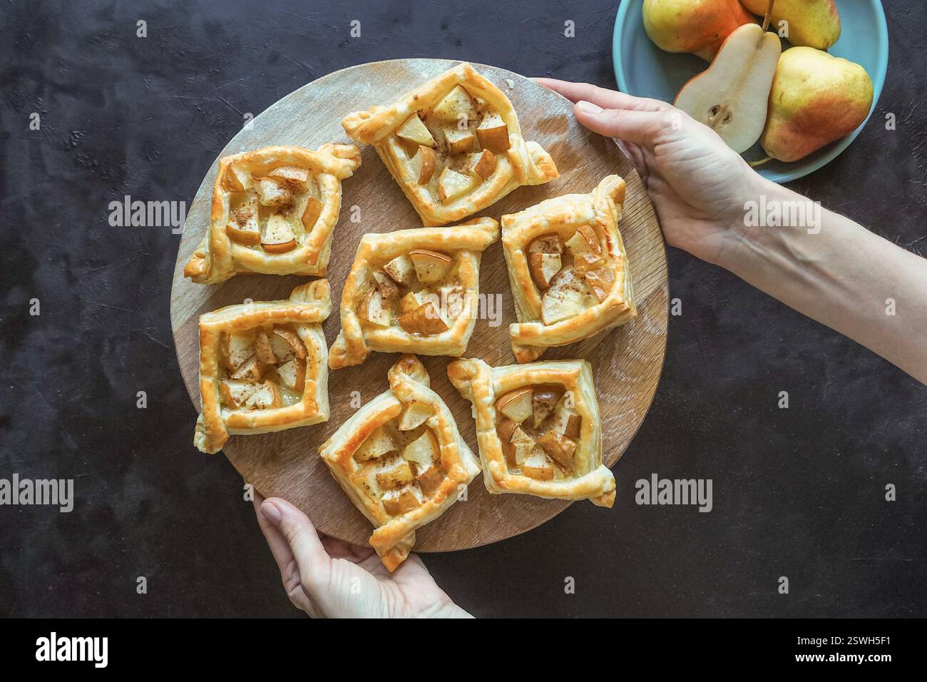 Pies of puff pastry with pears. Homemade cake. The view from the top ...
