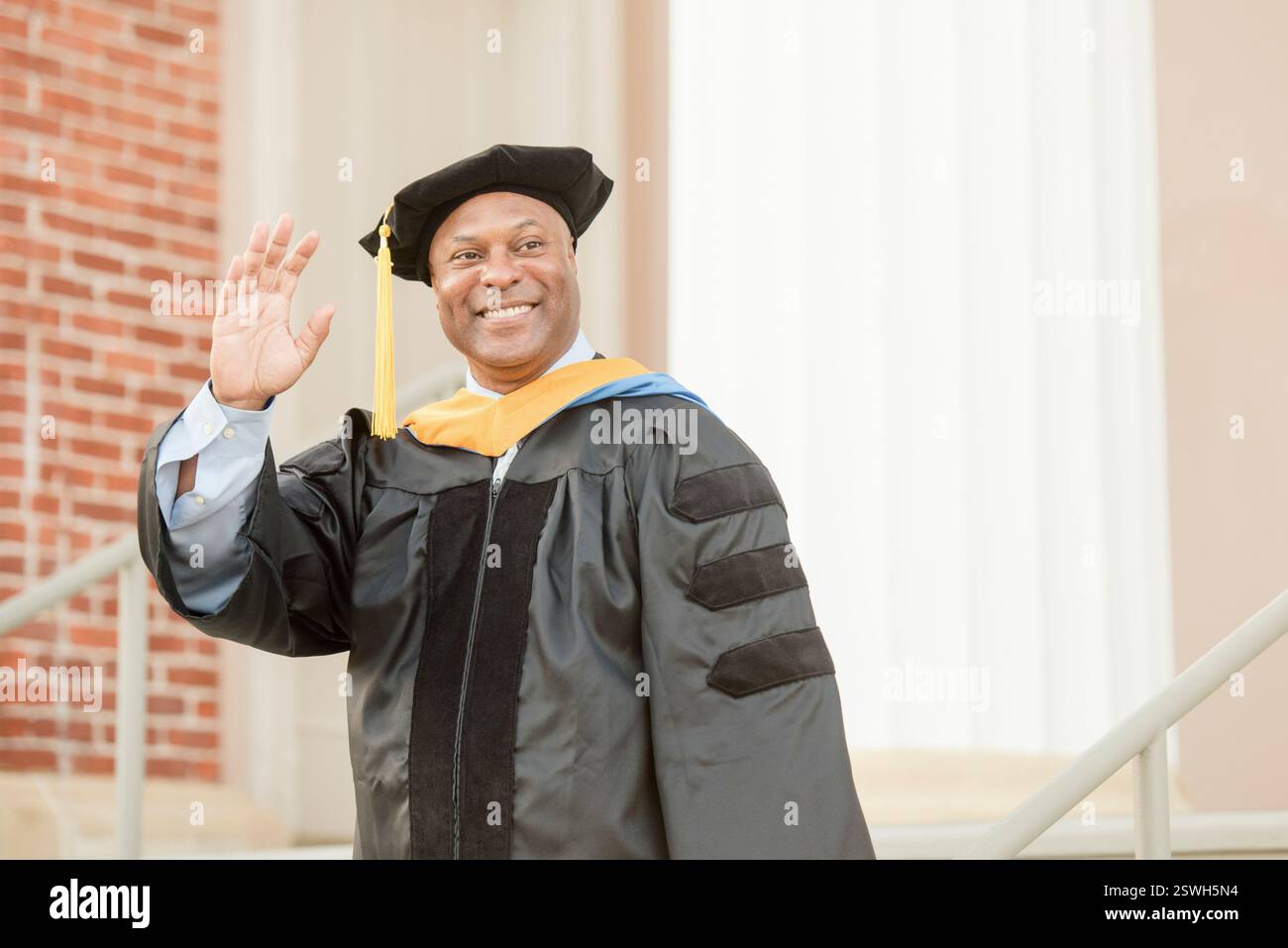 Graduate beaming with pride, stepping into a new chapter Stock Photo ...