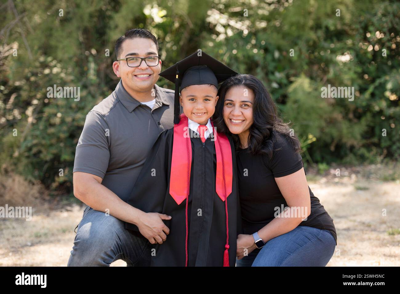 Proud parents celebrate their child's graduation milestone Stock Photo ...