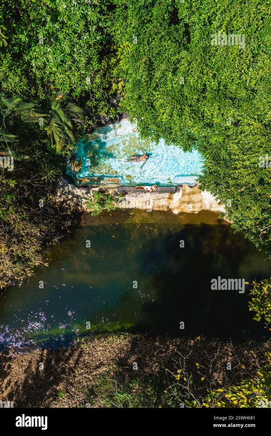 Exploring hidden pools in the lush greenery of Thailand and Bali Stock ...