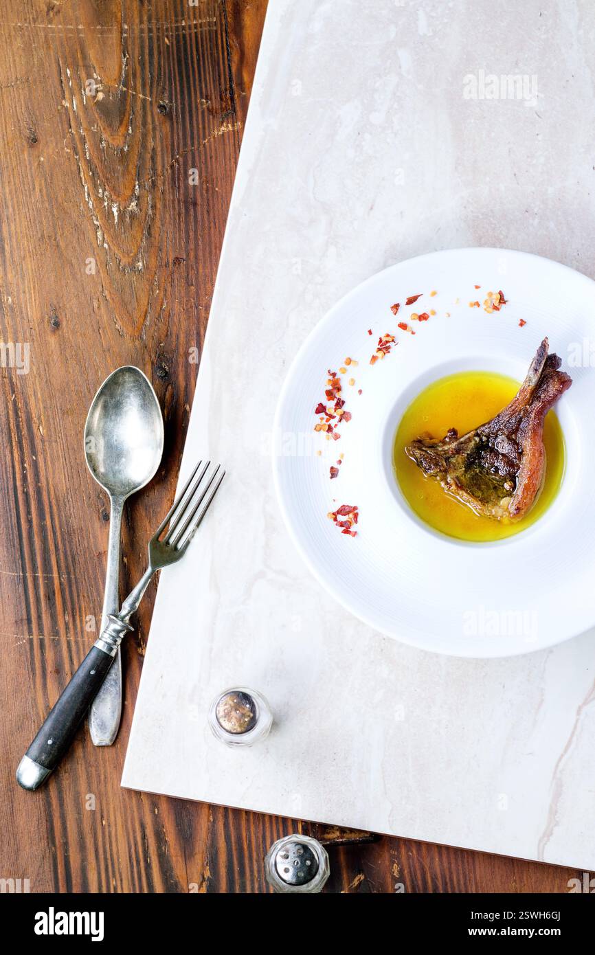 Well done grilled lamb chop Stock Photo - Alamy