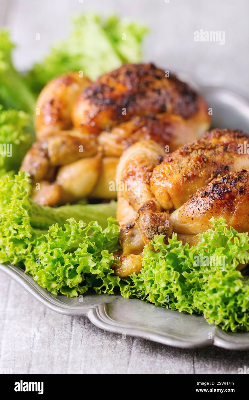 Whole Grilled mini chicken Stock Photo - Alamy