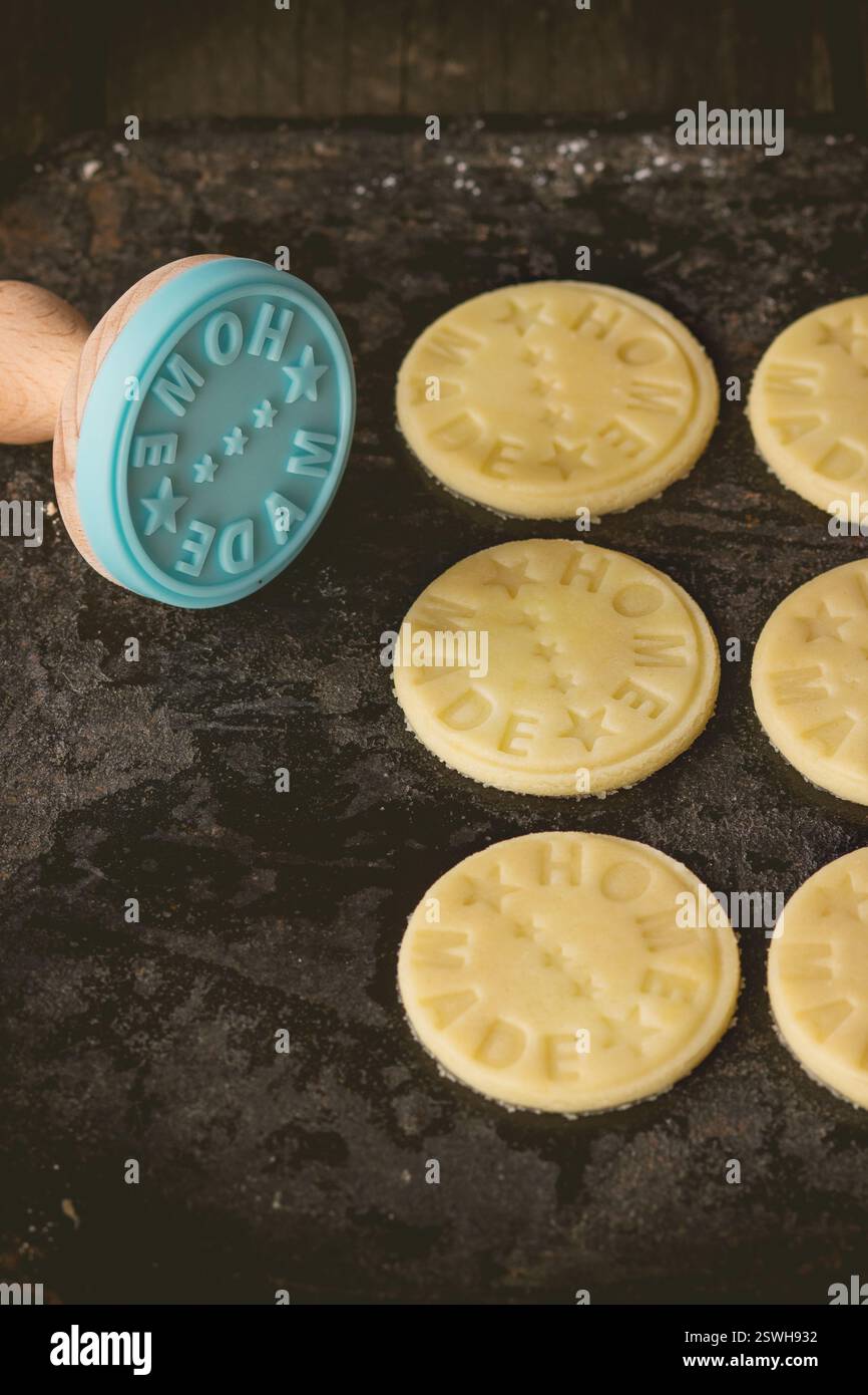 Uncooked shortbread before being to be baked, with blue stamp with ...