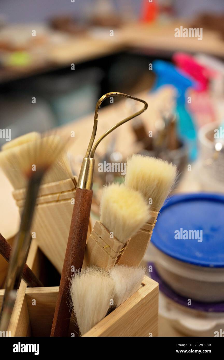 Close-up of art brushes and sculpting tools in a creative studio Stock ...
