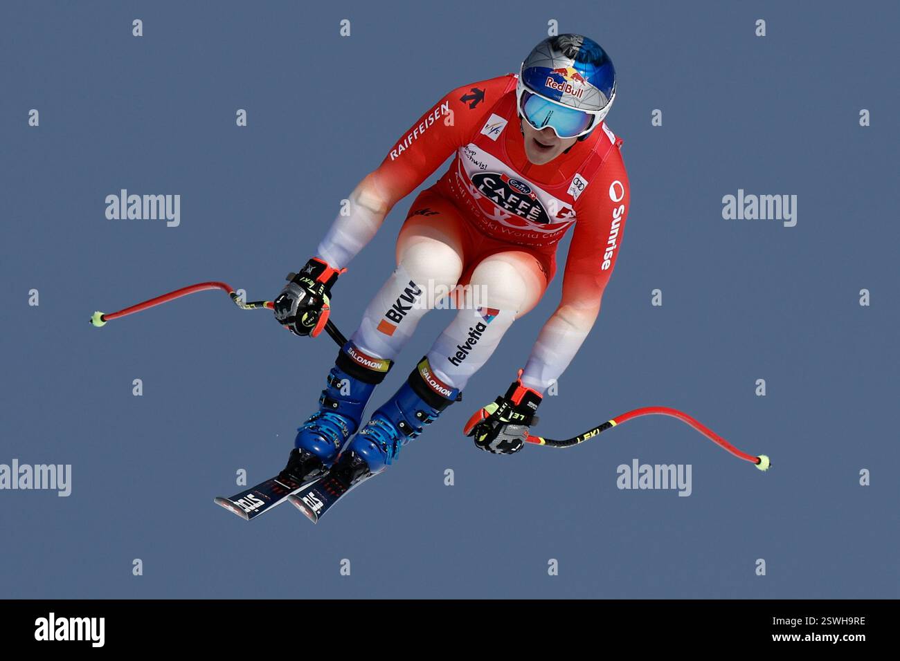 Switzerland's Marco Odermatt is airborne as he speeds down the course ...
