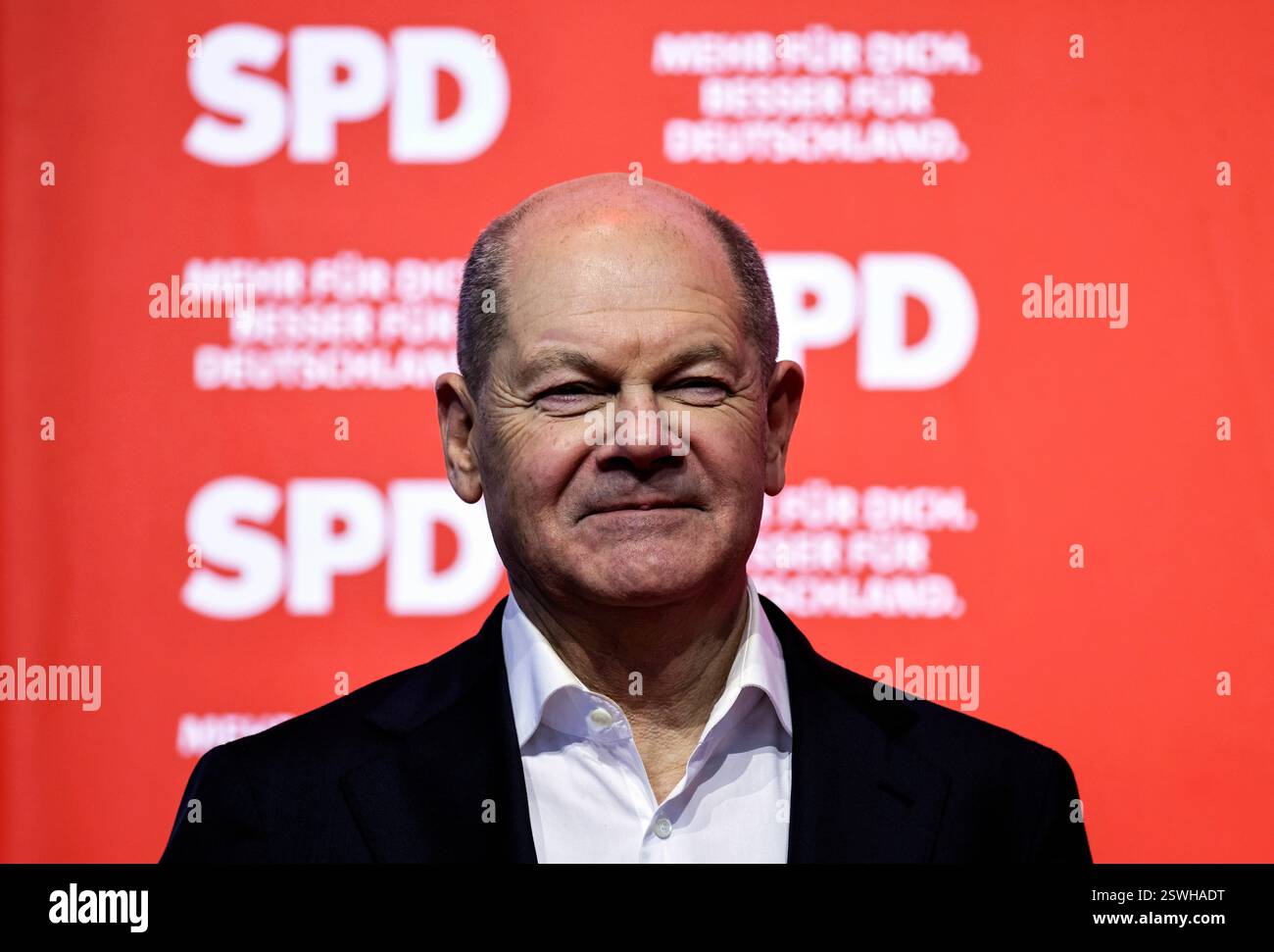 German Chancellor Olaf Scholz looks on during an election campaign ...
