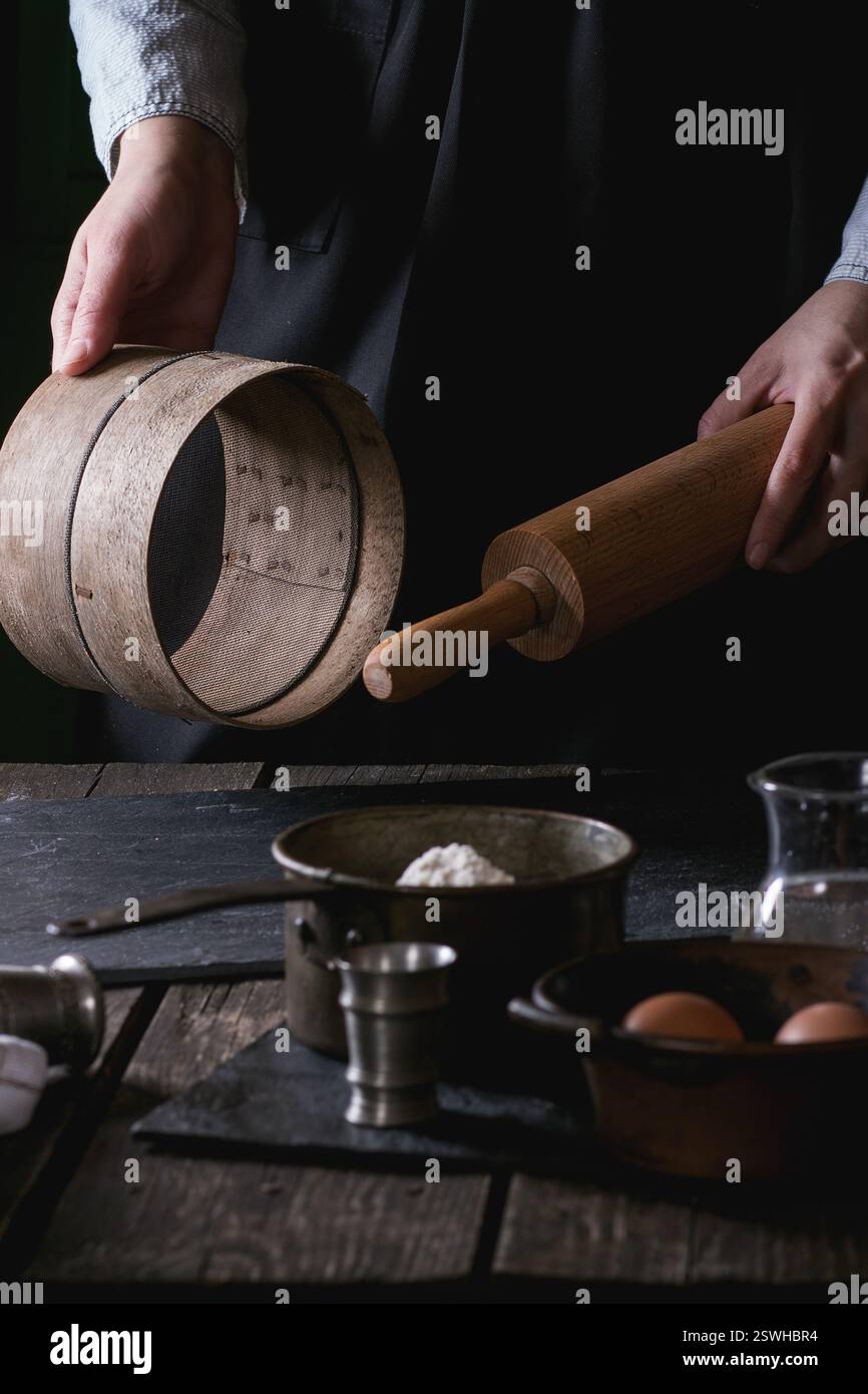 Female hands with wooden rolling-pin and sieve Stock Photo - Alamy