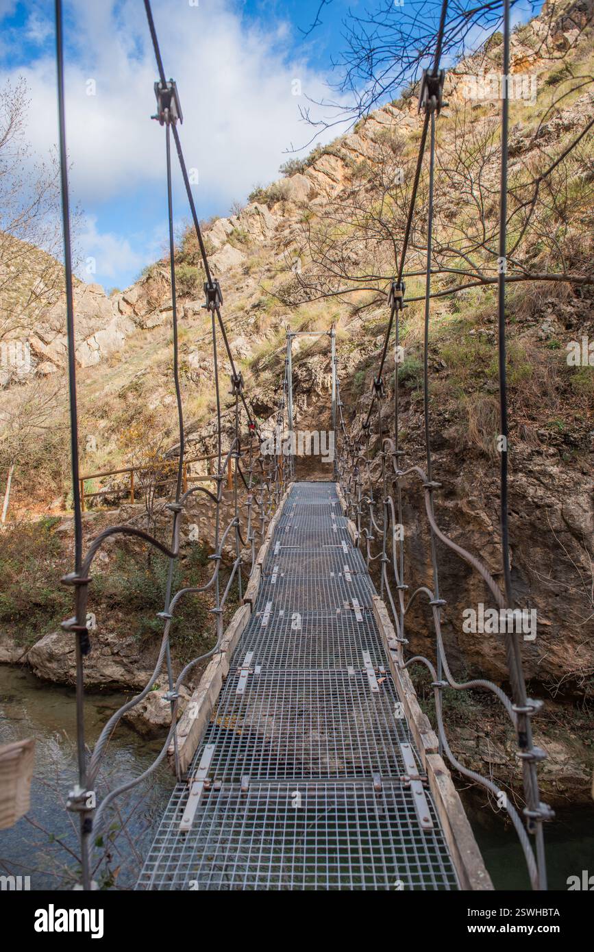 Tourist crossing wooden suspended bridge hi-res stock photography and ...