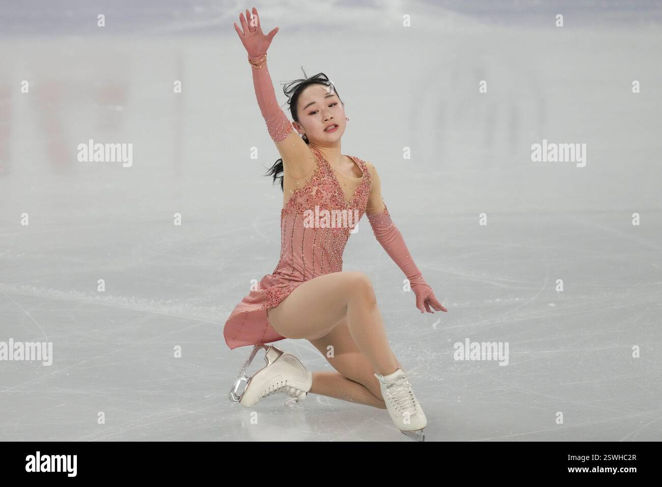 Rino Matsuike of Japan waves as she performs during the women's short ...