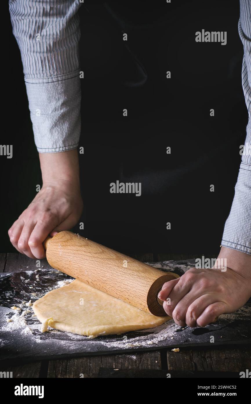 Pizza baker rolling out hi-res stock photography and images - Alamy