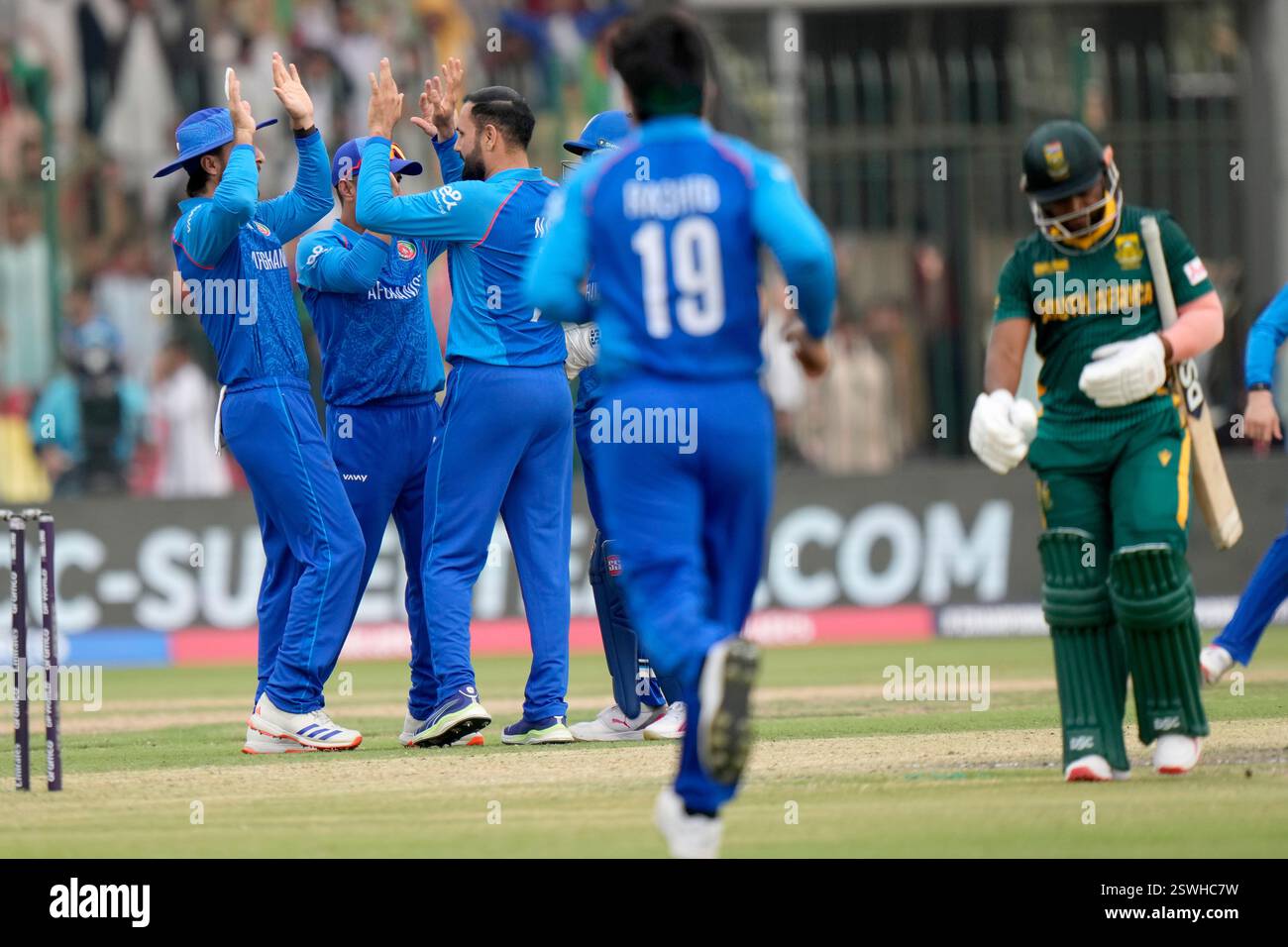 Afghanistan's Mohammad Nabi, third left, celebrates with teammates ...