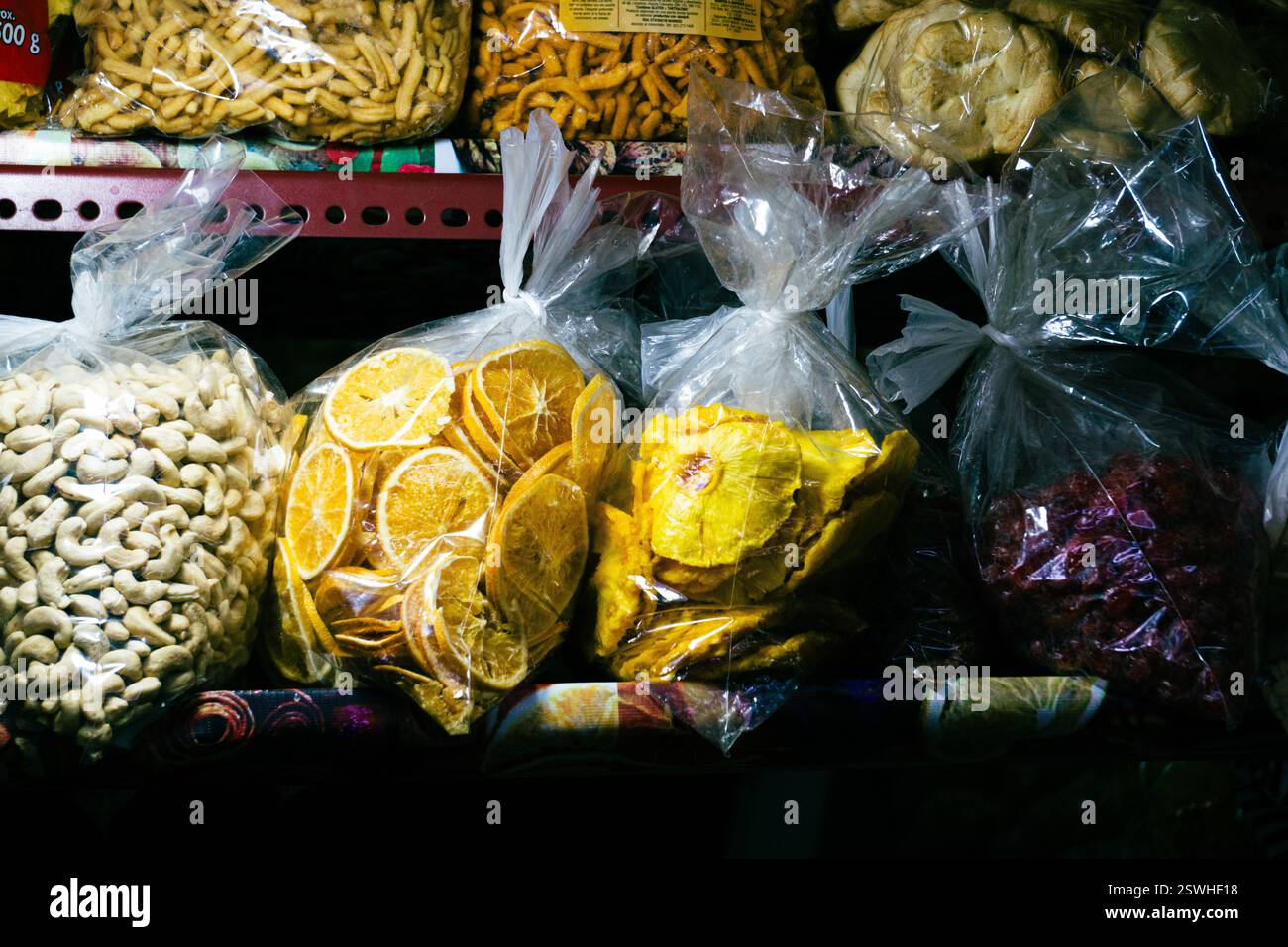 A vibrant composition of dried mango orange slices cashews and raisins ...