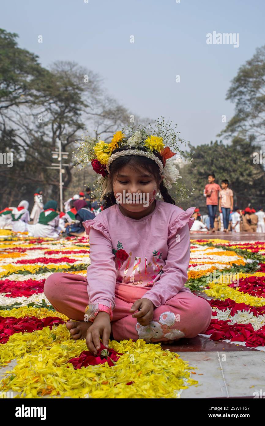 Dhaka, Bangladesh. 21st Feb, 2025. A child pays tribute at the Martyr's ...