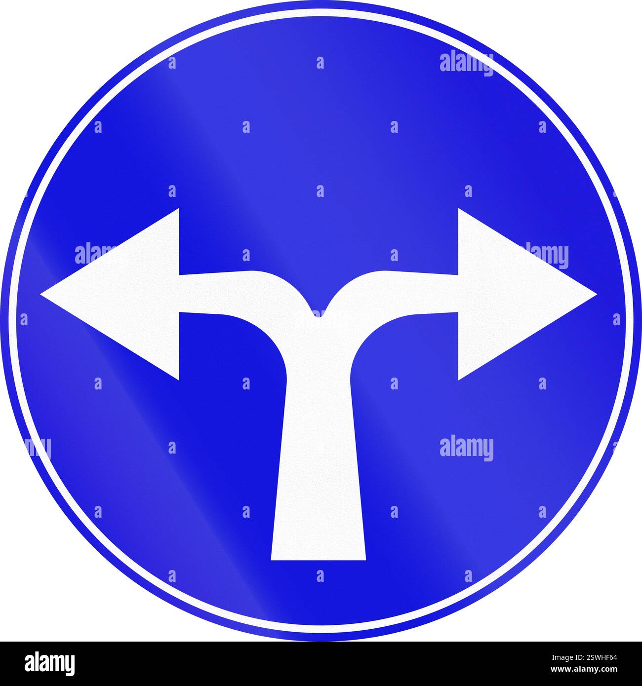 Israel mandatory road sign - turn left or right Stock Photo - Alamy