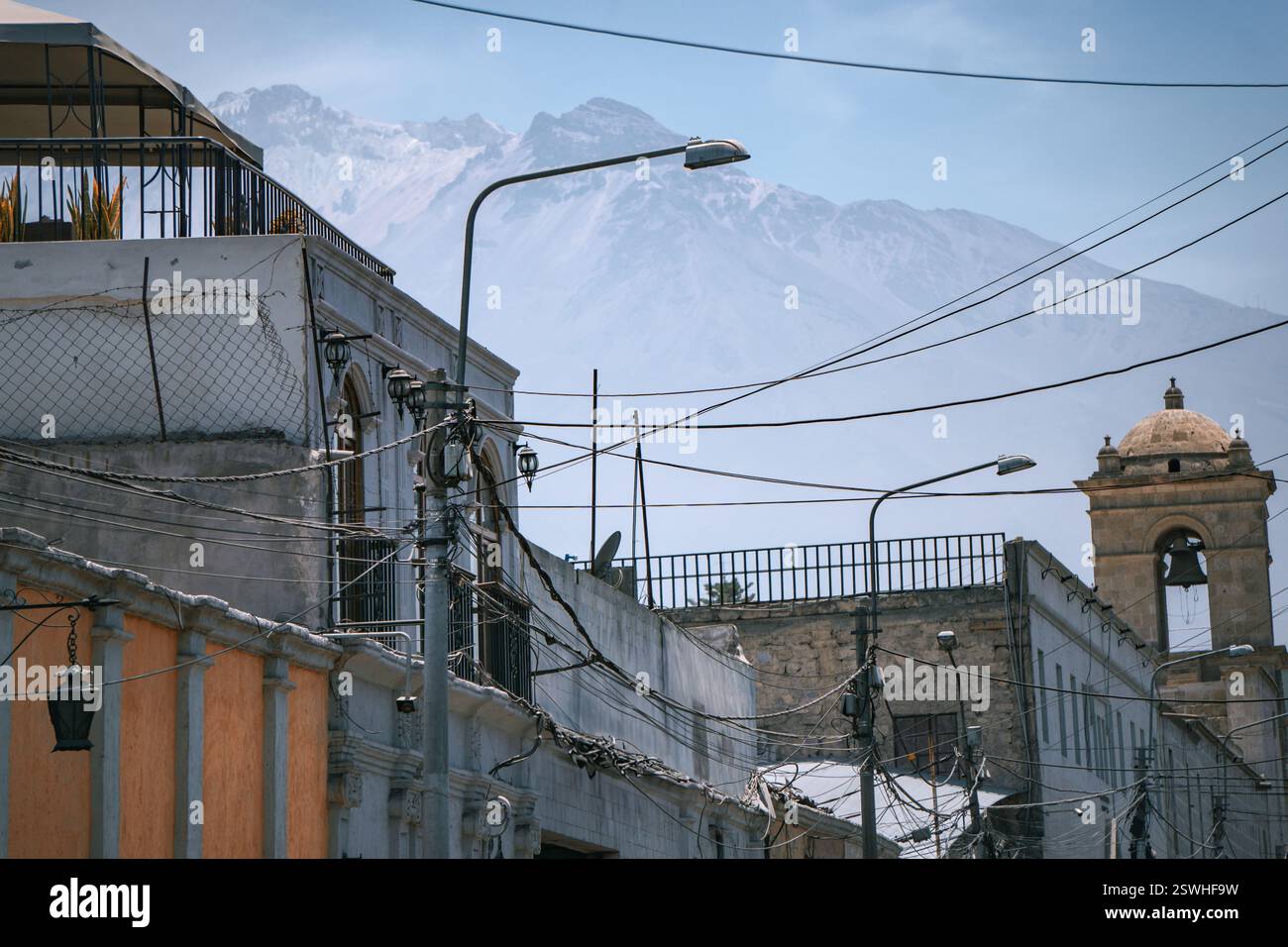 A picturesque street in Arequipa with colonial architecture and ...