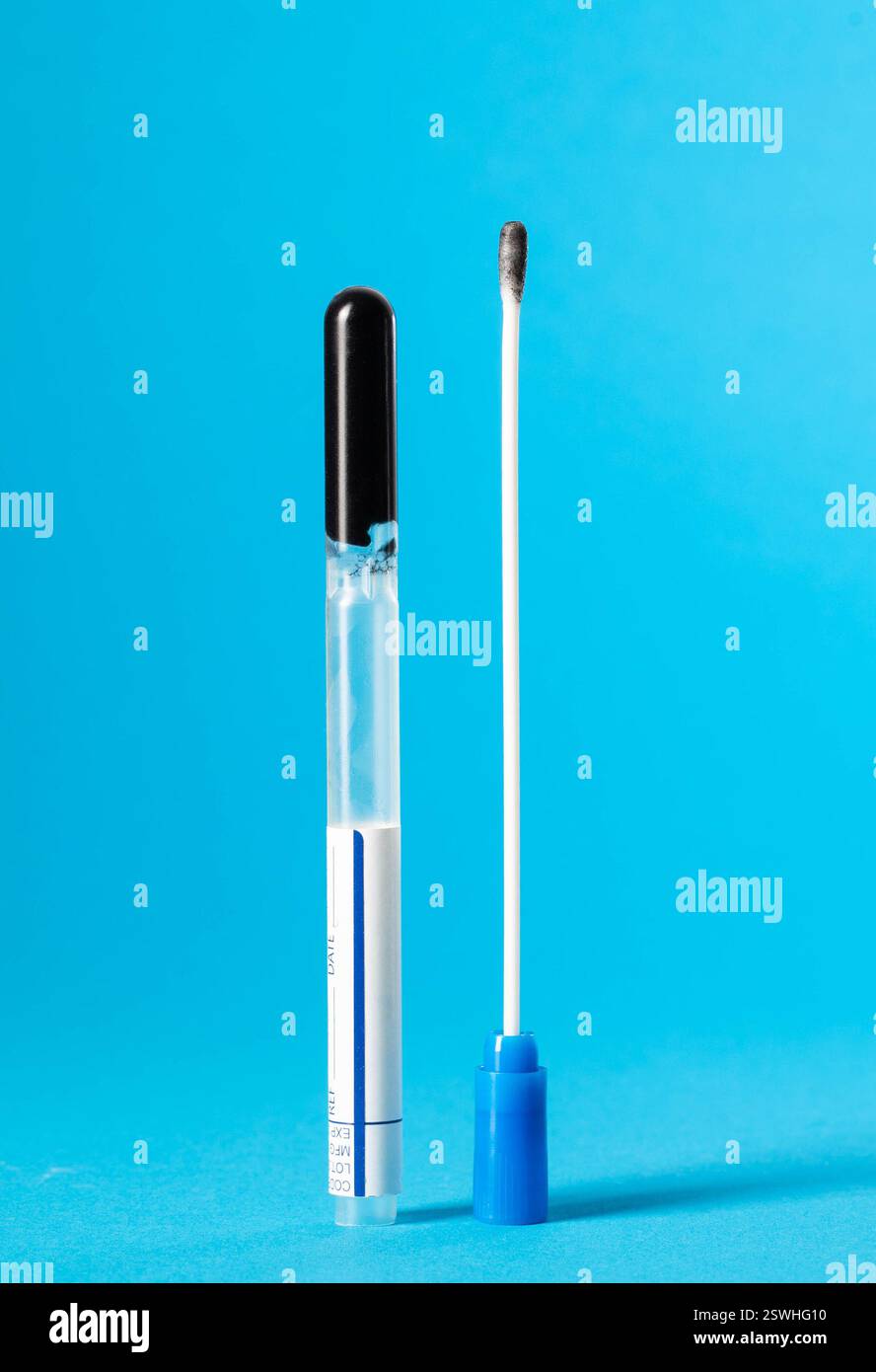 Sterile probe with a cotton swab for taking a nasal swab on a blue ...