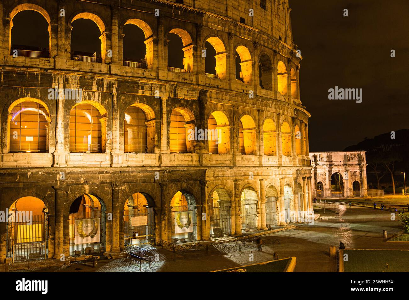 The amphitheater Colosseum lit up at night in Rome, Italy Stock Photo ...