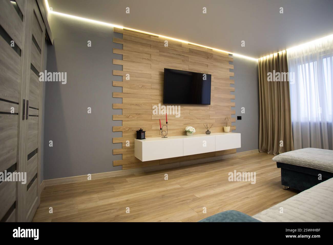 Modern interior in the living room with wooden laminate flooring, wall ...