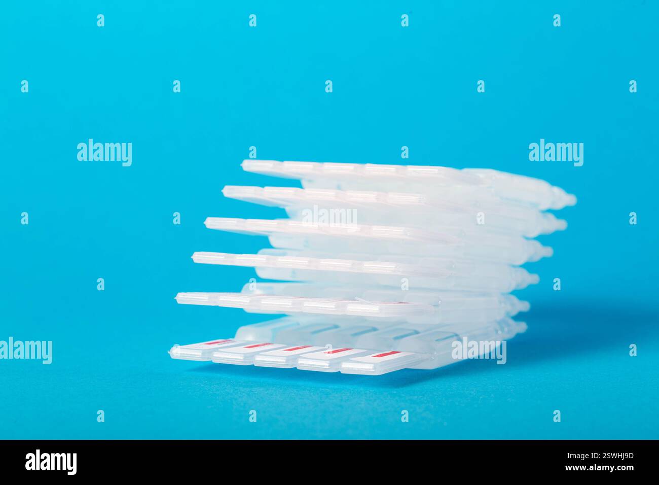 Tubes with medicine on a blue background. Concept of a laxative for the ...