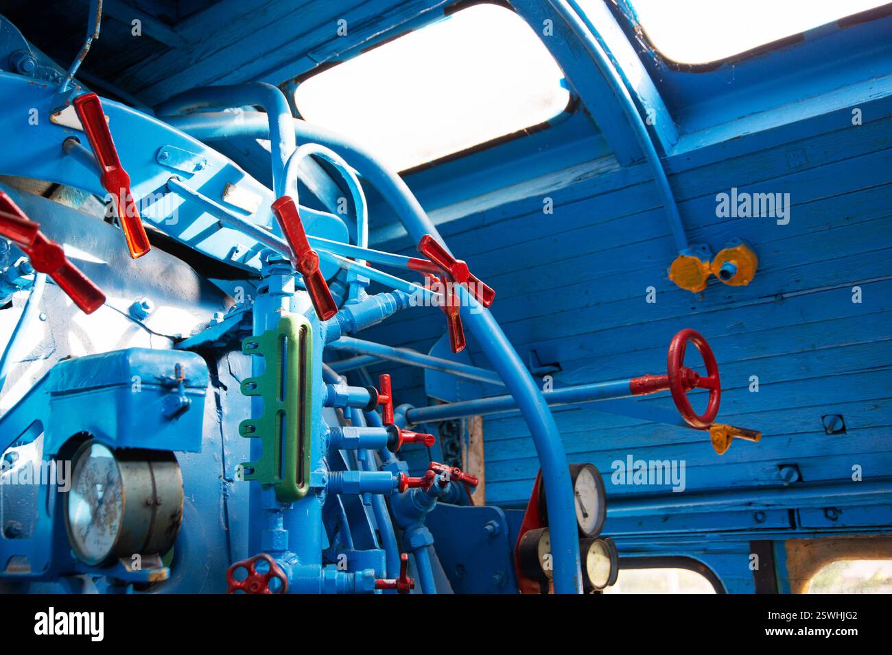 Control panel of an old steam locomotive inside with gauges and ...