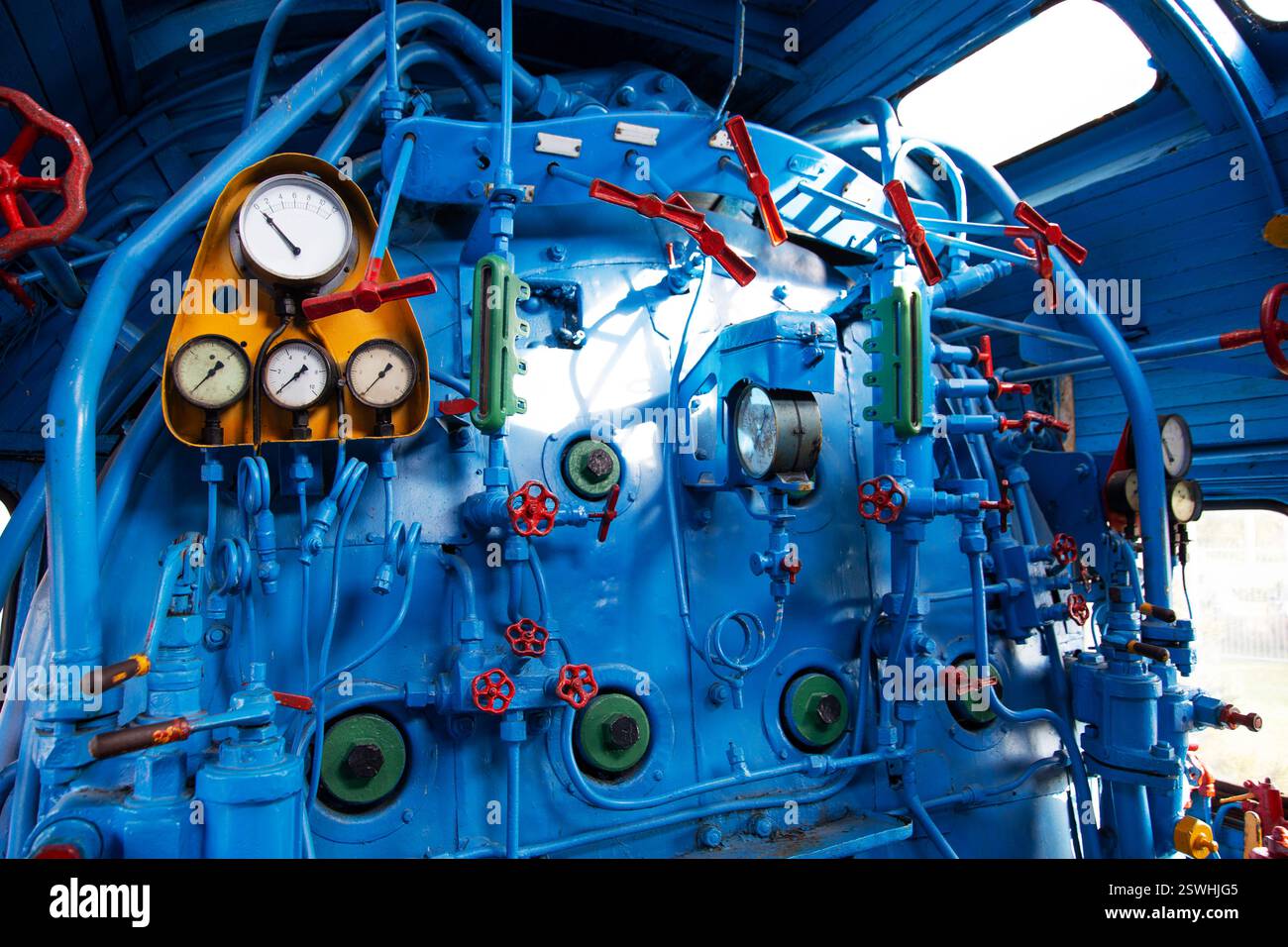 Control panel of an old steam locomotive inside with gauges and ...