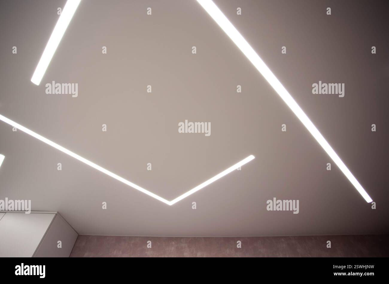 Modern stylish stretch ceiling with LED light lines Stock Photo - Alamy