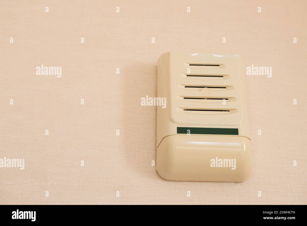 Wall-mounted device for sound notification in case of emergency and ...