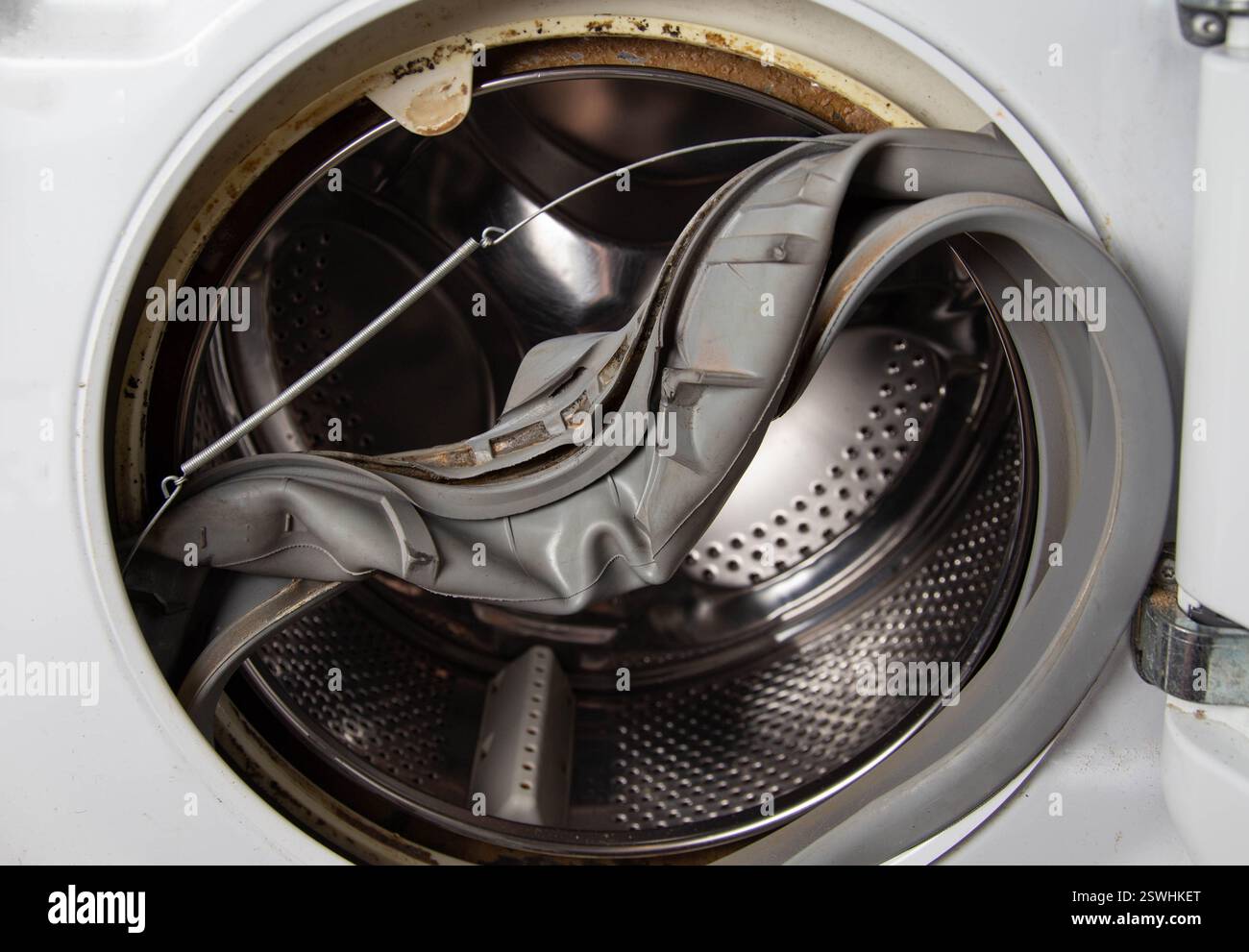 Old rubber hatch seal with washing machine defect Stock Photo - Alamy