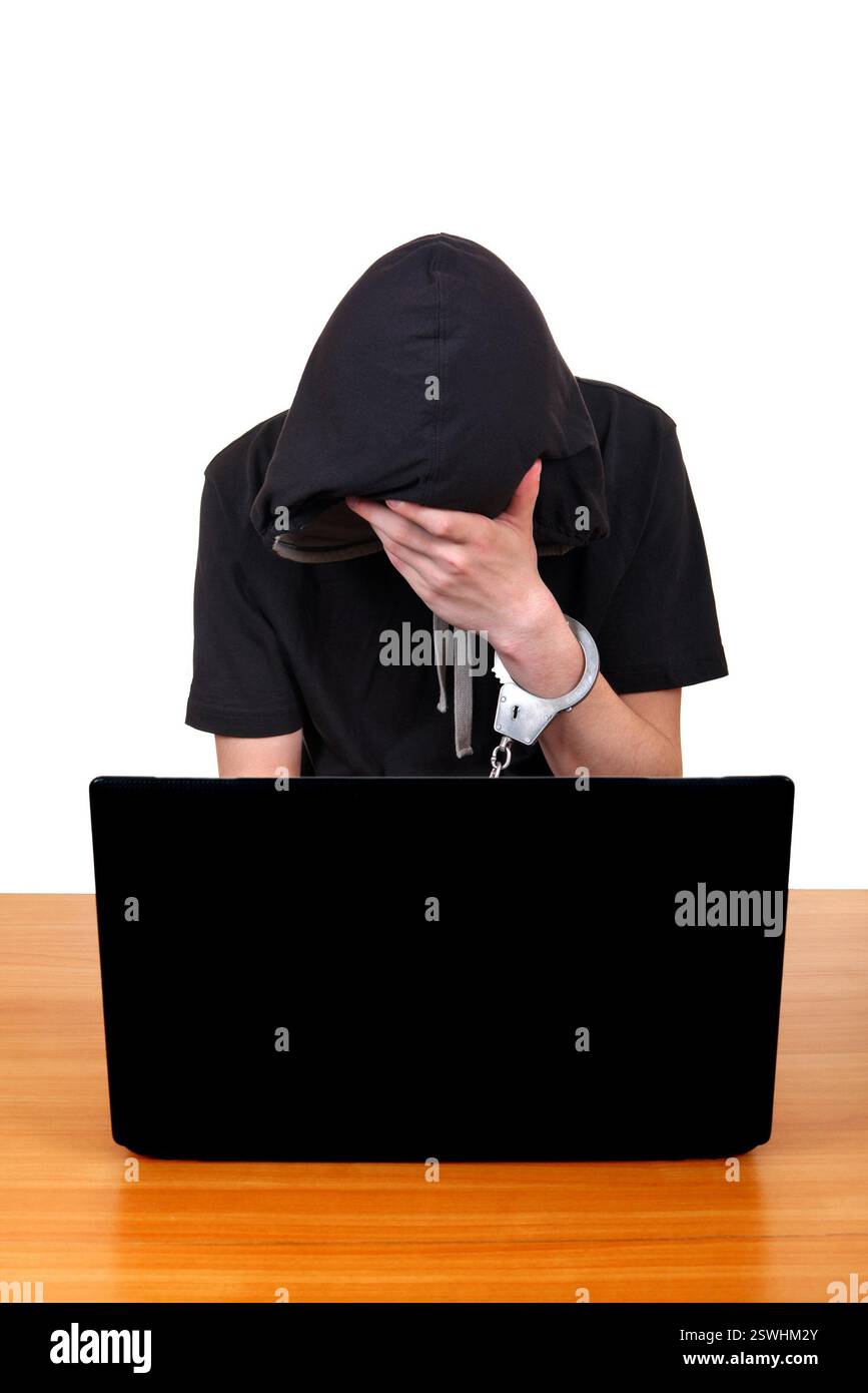 Man in Handcuffs at the Desk with Laptop Isolated on the White ...