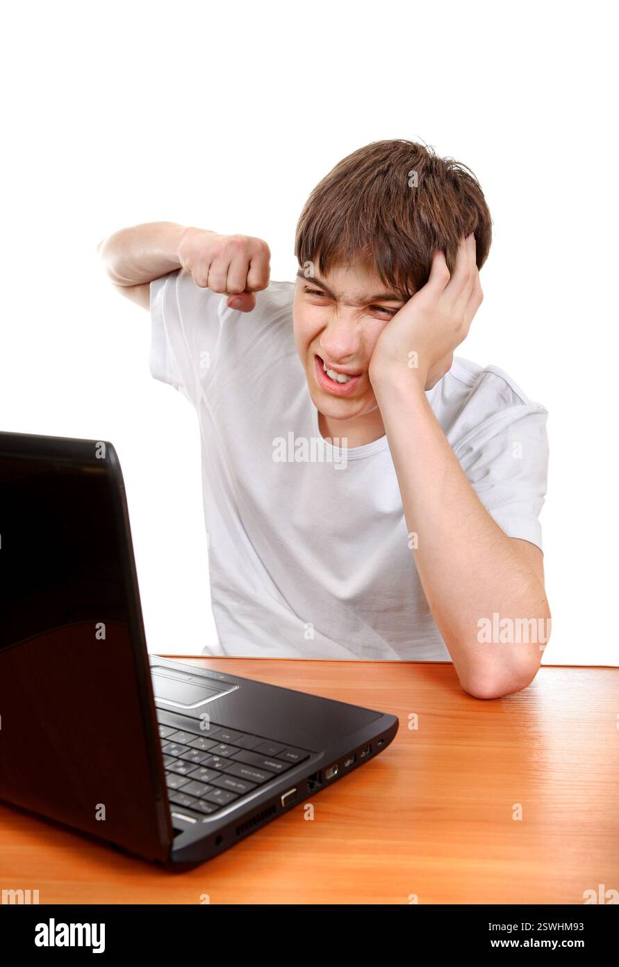 Nervous Teenager shows the Fist to Laptop Screen Isolated on the White ...