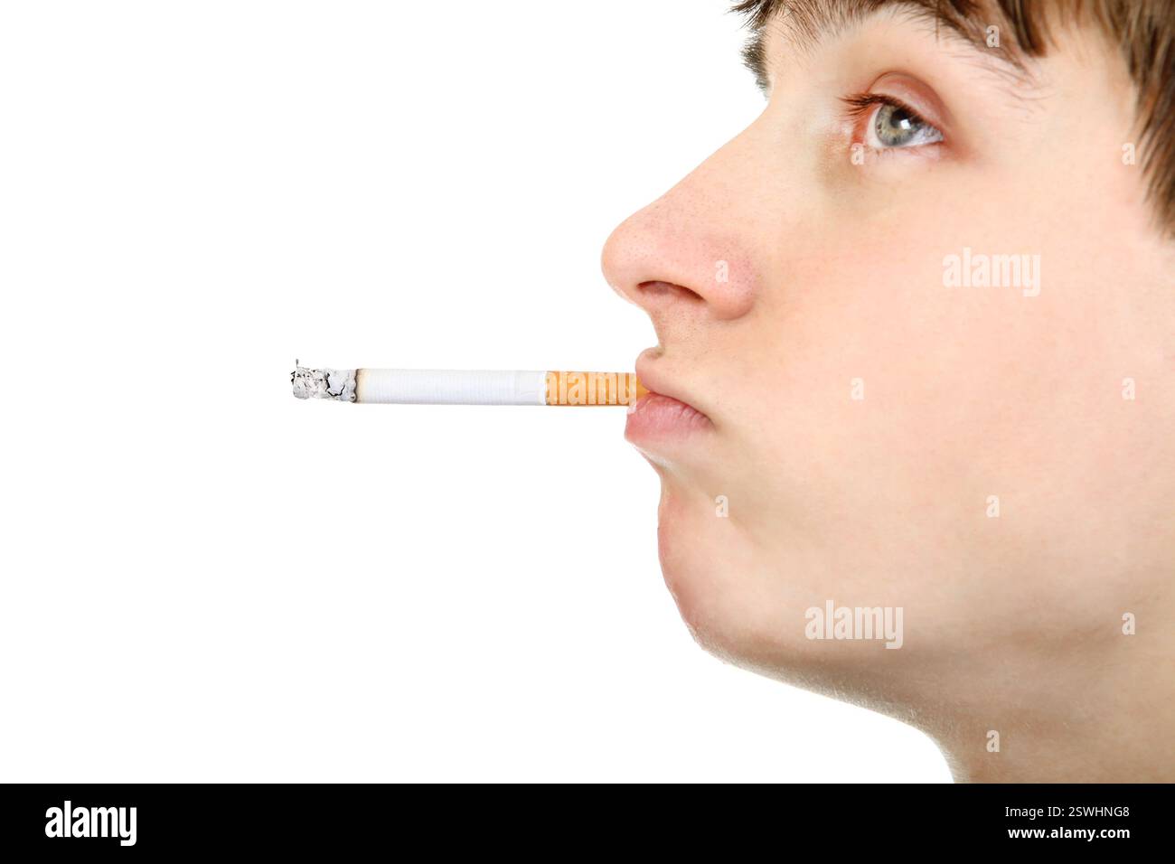 Side view of Teenage Face with cigarette on the White Background Stock ...