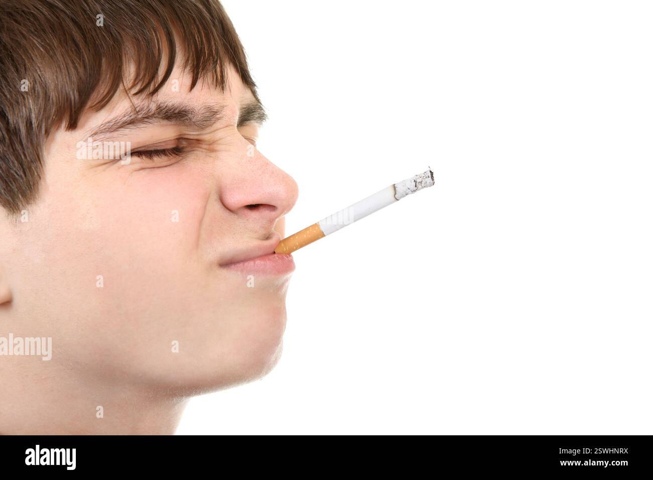 Side view of Teenage Face with cigarette on the White Background Stock ...