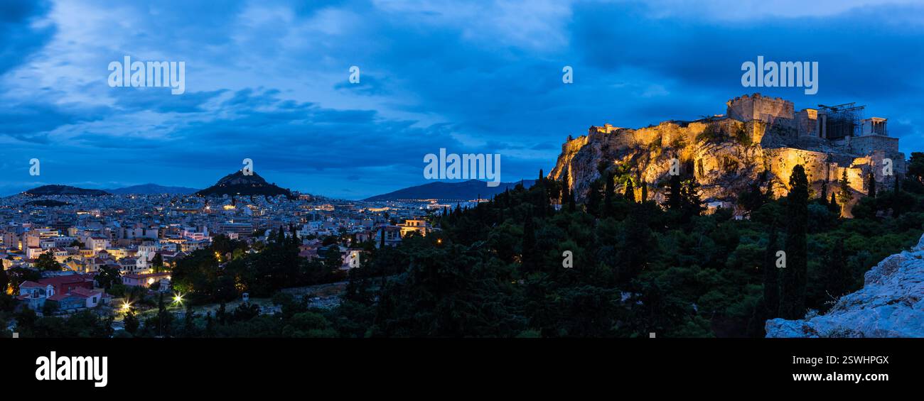 The Acropolis and the Parthenon and the night view seen from the Aleopagus Hill in Athens ...