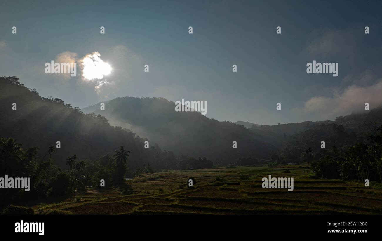 Aerial view of the sun above The sun over the mountain peaks shines ...