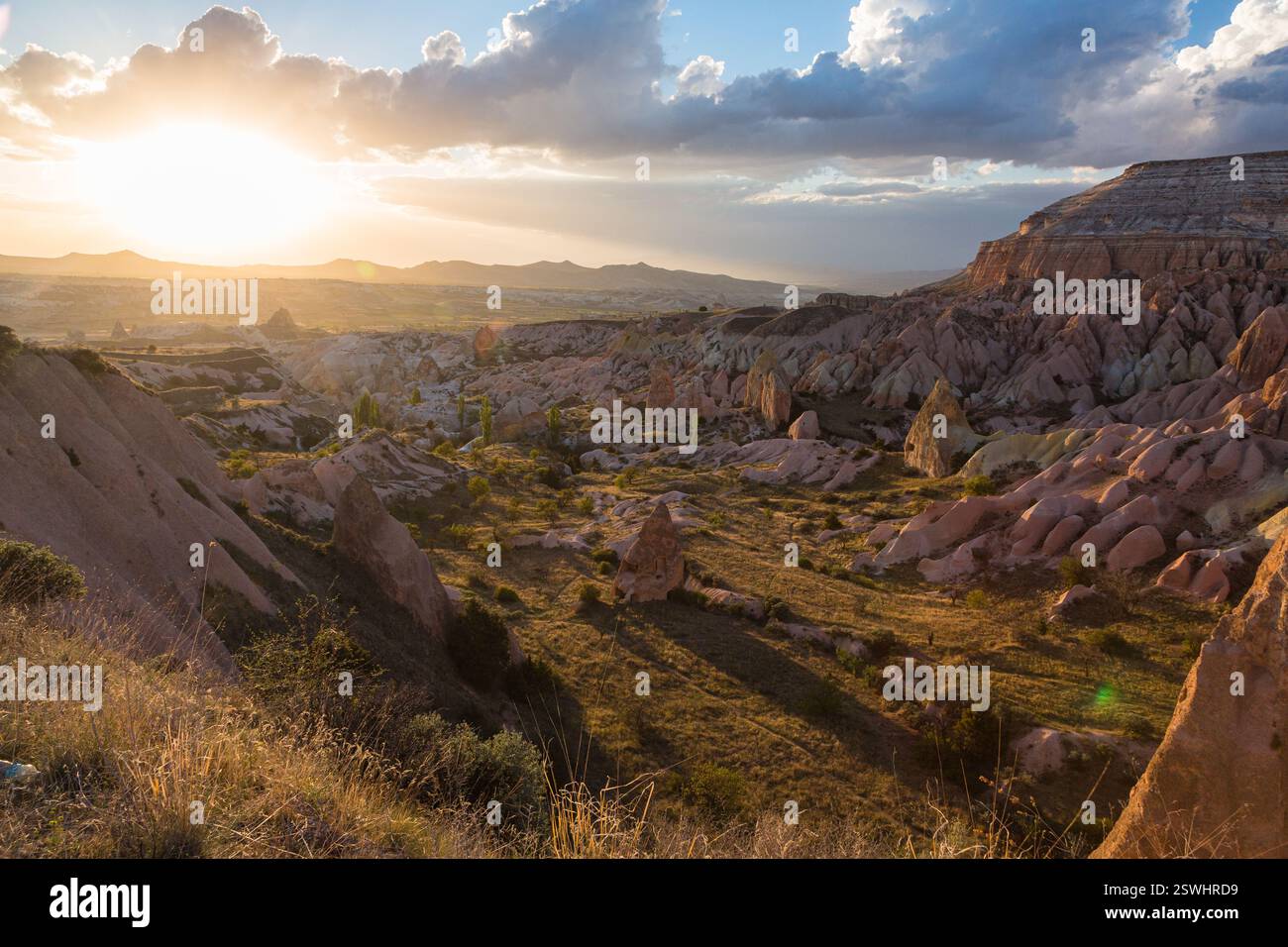 Strange rocks, cave dwellings and sunset sky in the Rose Valley of ...