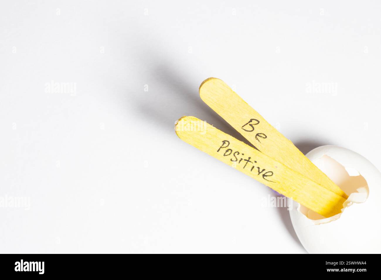 close up of a hand written message on a popsicle stick stating be ...