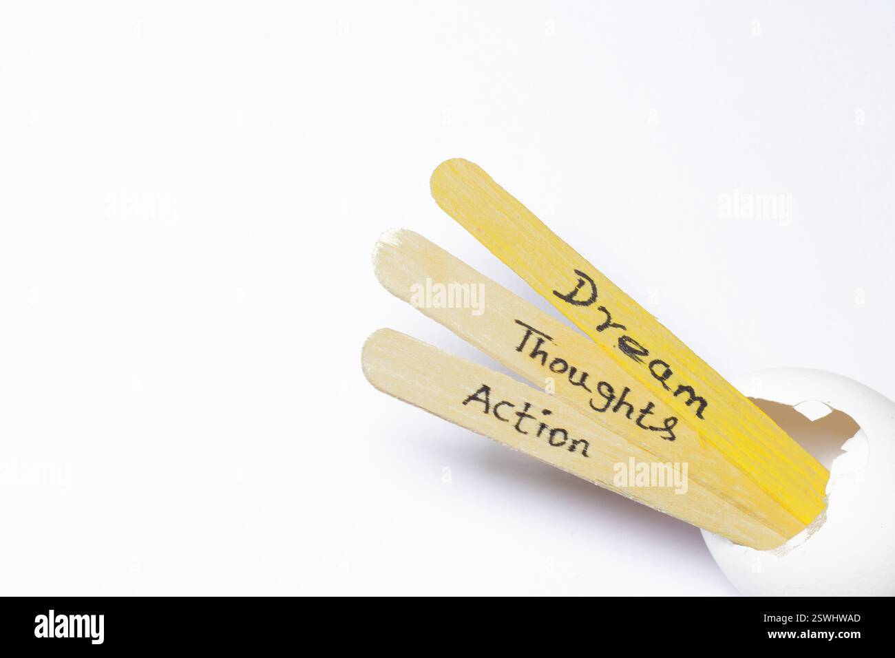 close up of a hand written message on a popsicle stick stating Dream ...
