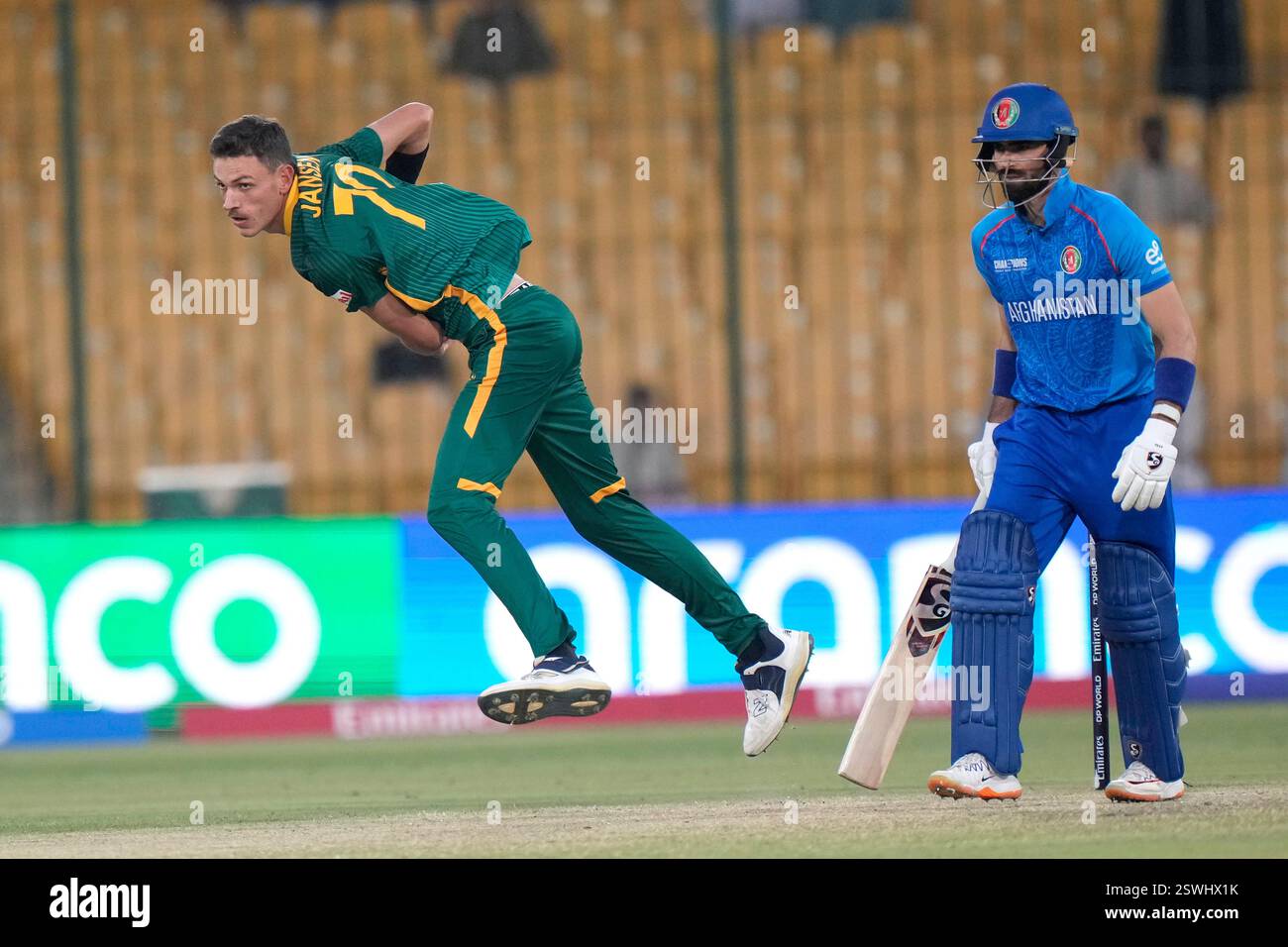 South Africa's Marco Jansen, left, bowls as Afghanistan's Ibrahim ...