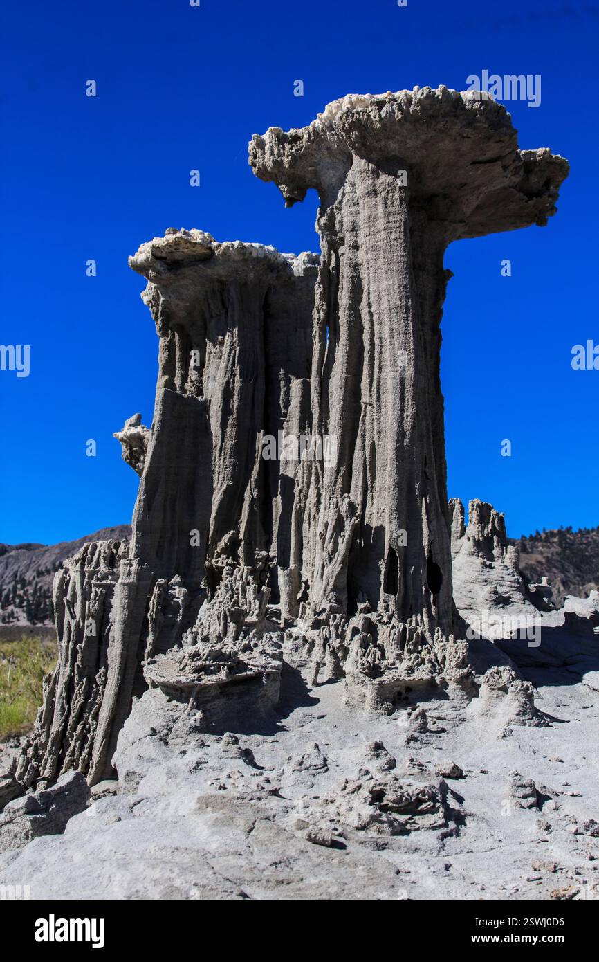Large rock formation with a pointy top. The rock formation is ...