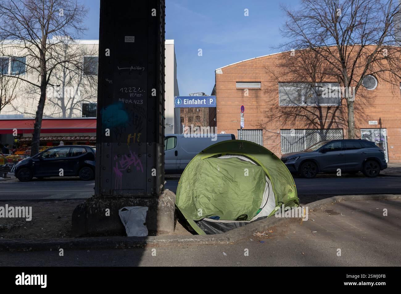 A homeless man's tent in Berlin Kreuzberg, under an elevated railway. A ...