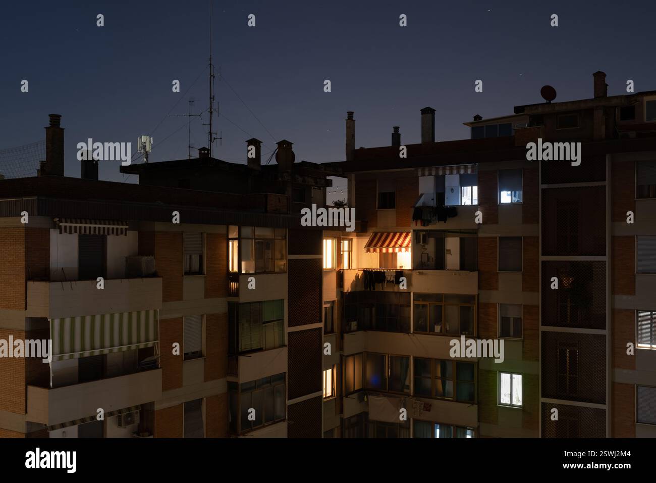 View of two facades linked in angles of a city apartment building. The ...
