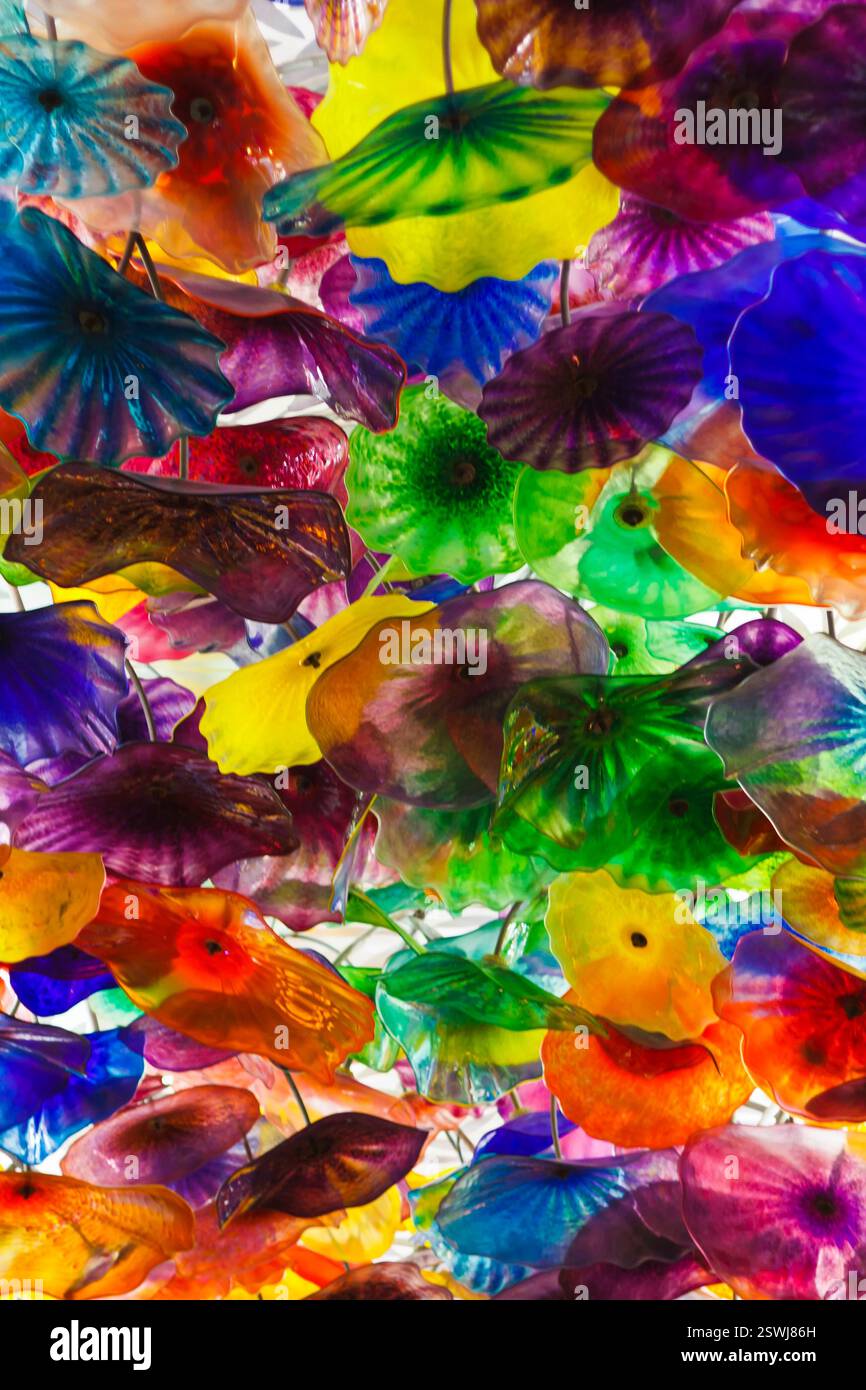 Colorful display of glass flowers with a variety of colors. The flowers ...