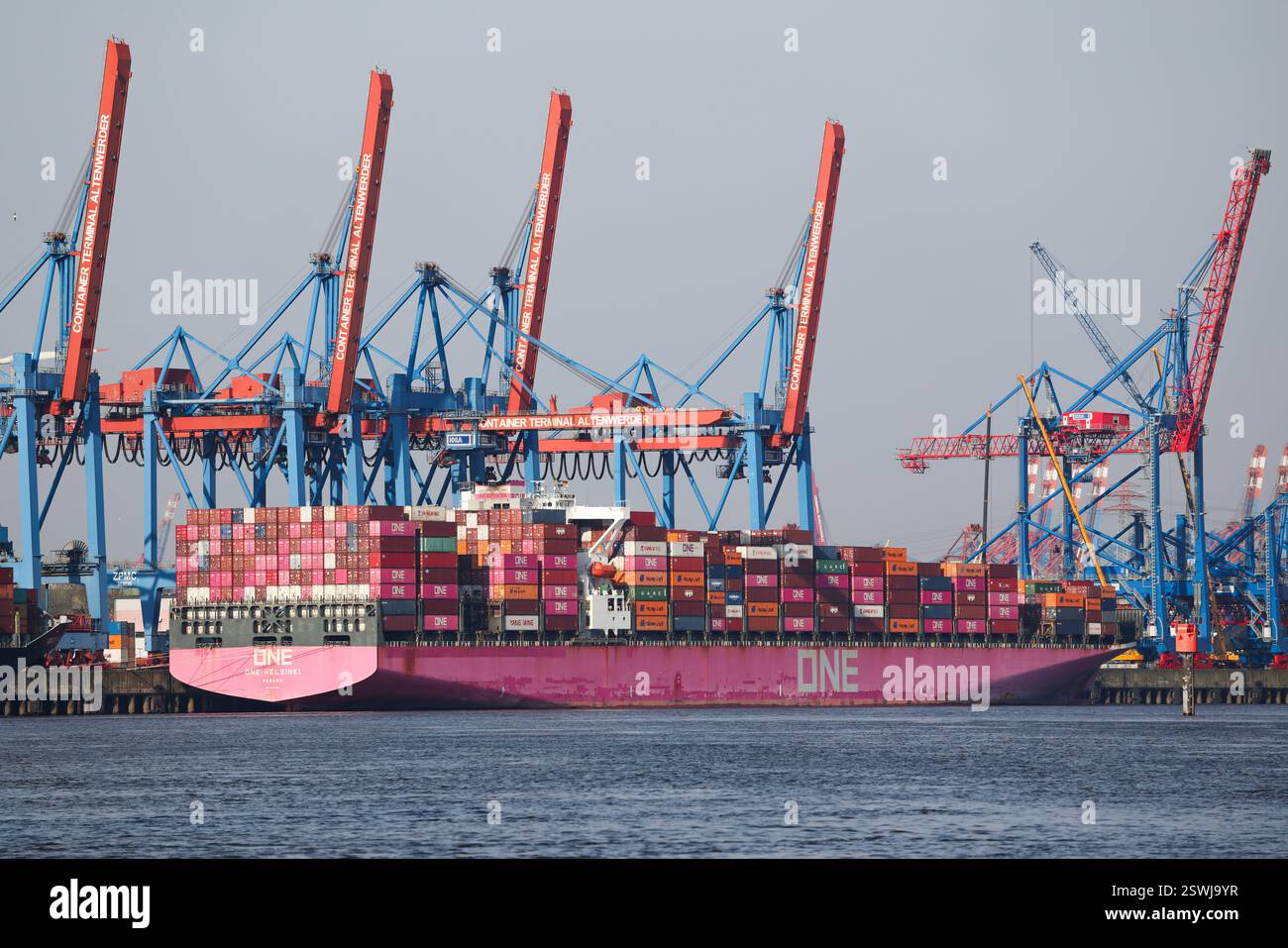 20 February 2025, Hamburg: Container ships are loaded and unloaded at the Container Terminal ...